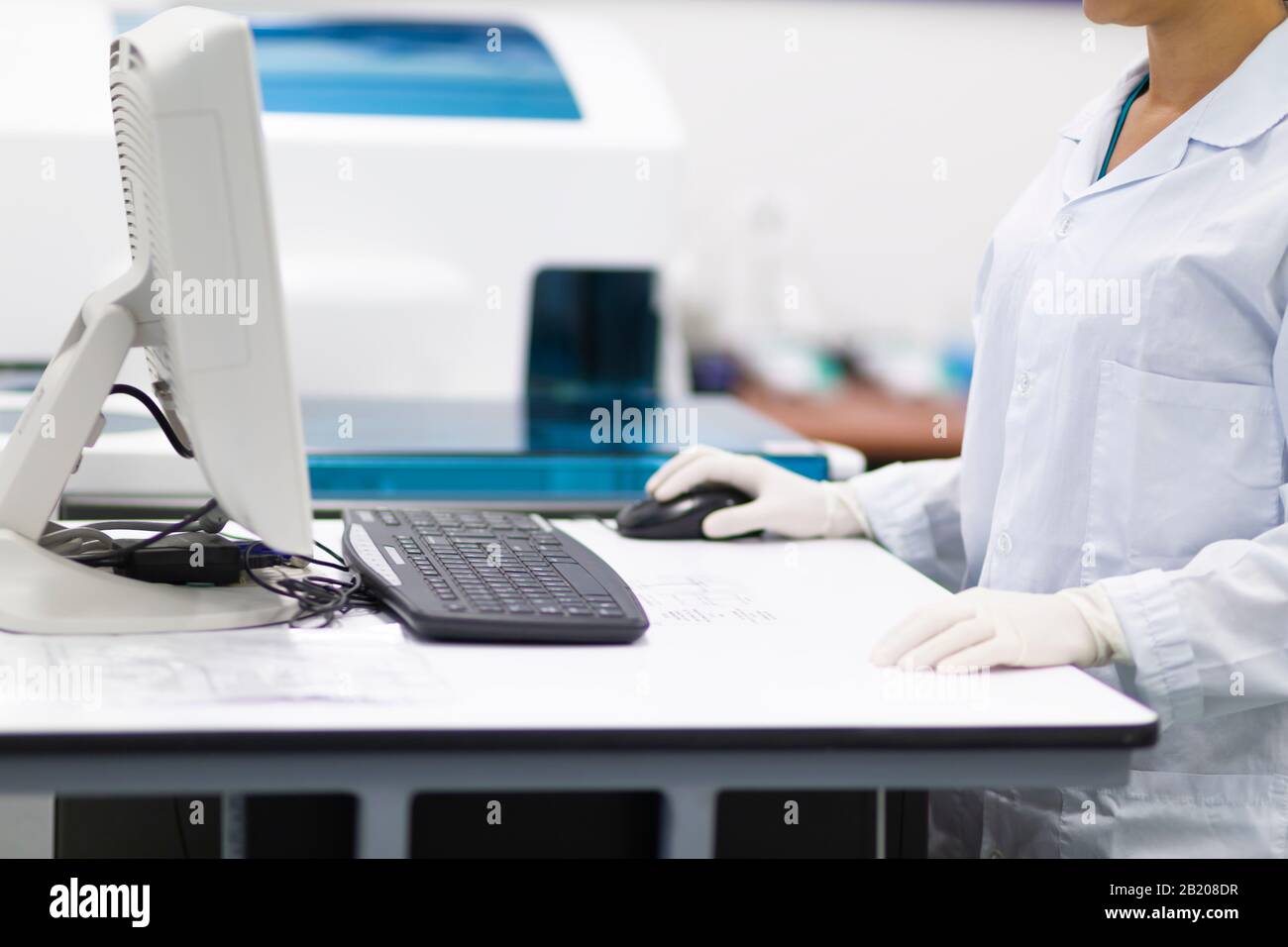 Female Nurse Working on Laptop Computer In Lab Stock Photo - Alamy