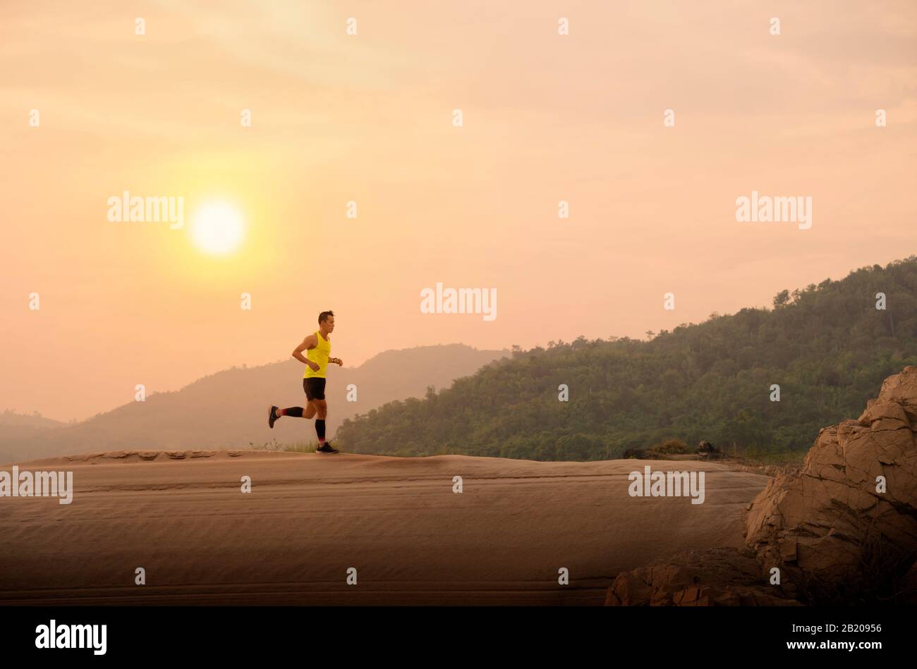 Athlete running on track sunrise hi-res stock photography and images ...