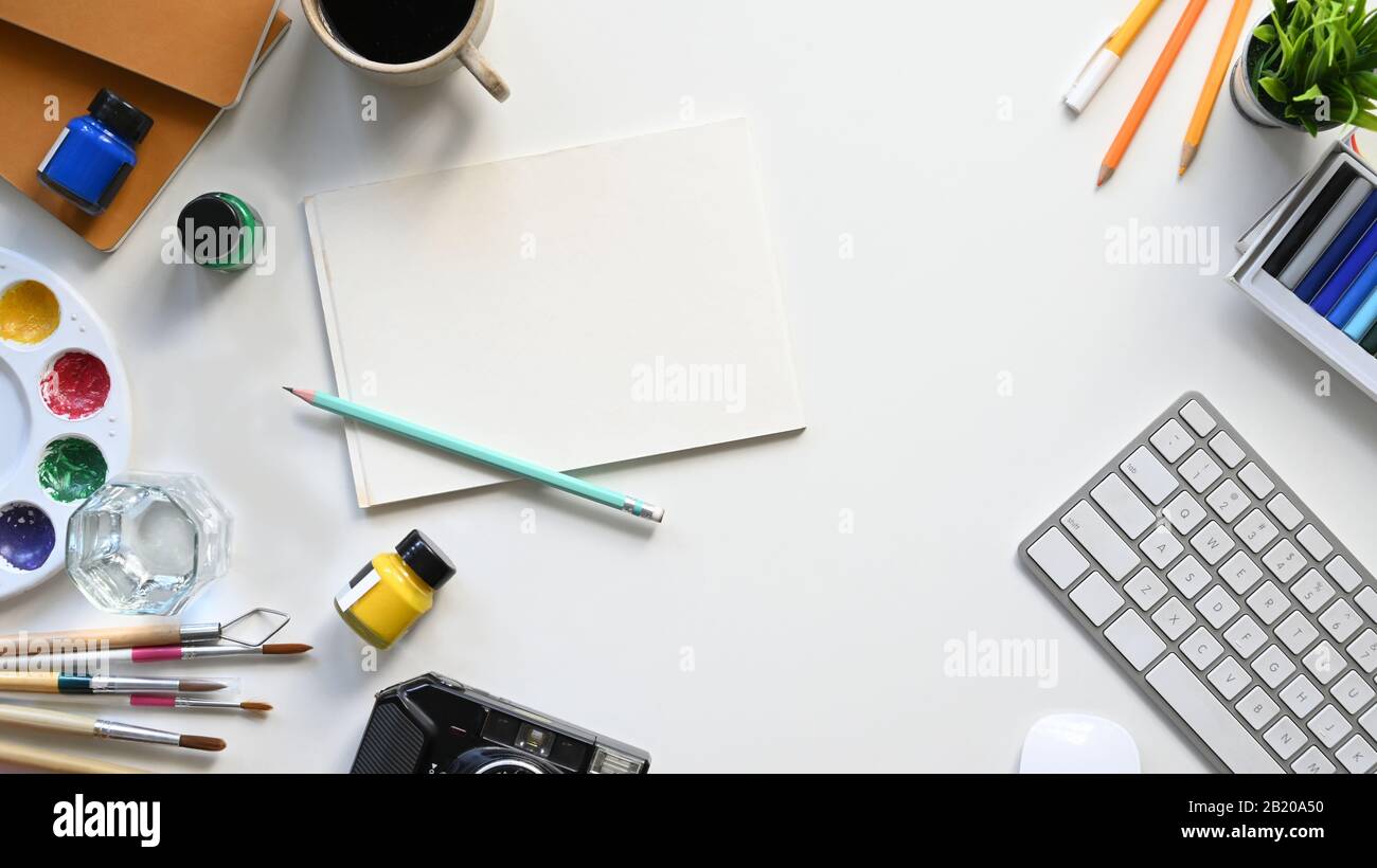 Top view image of Graphic designer working table flat lay with painting ...