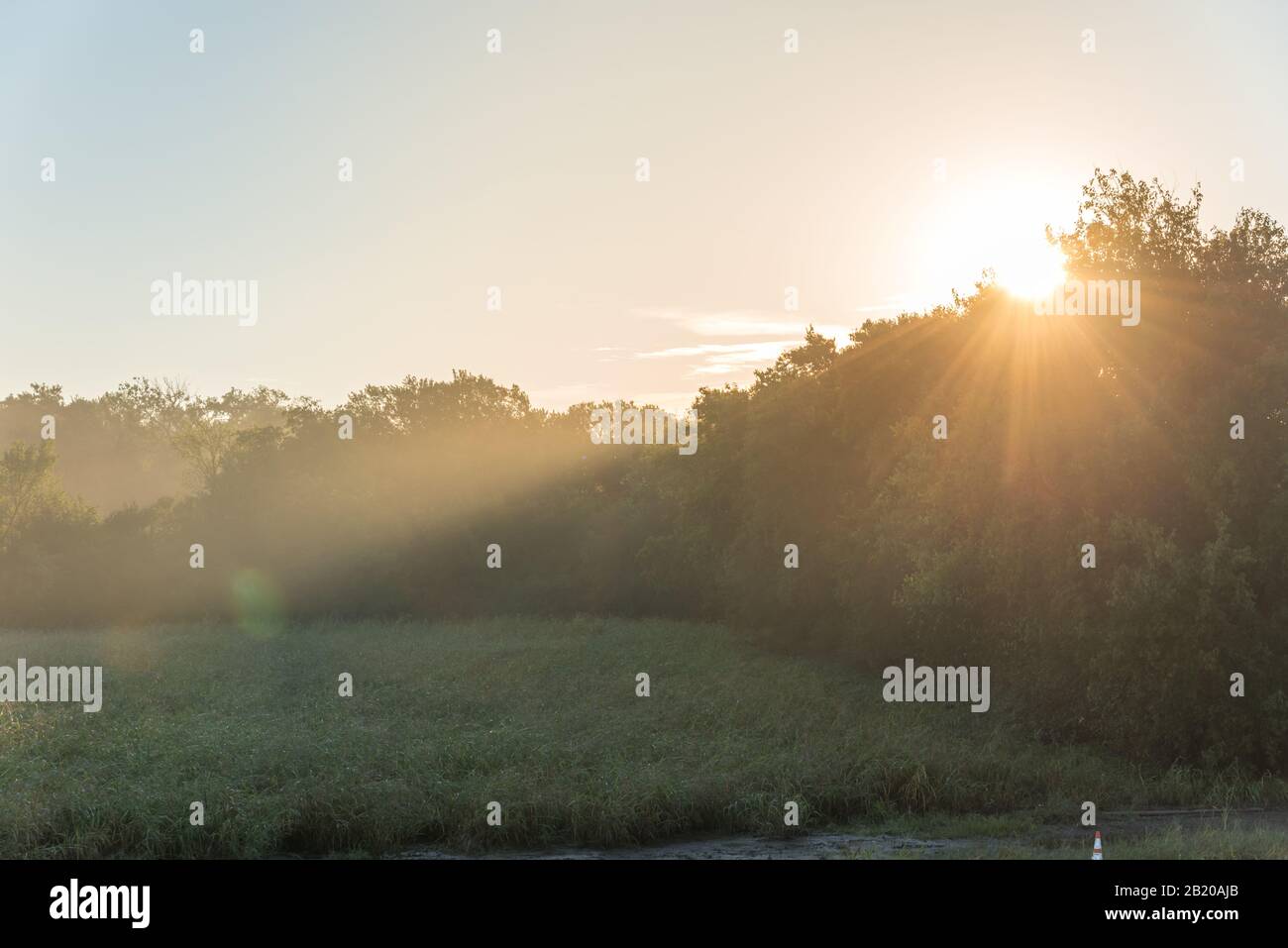 Sunrise with beautiful sun rays over nature trail near Dallas, Texas ...