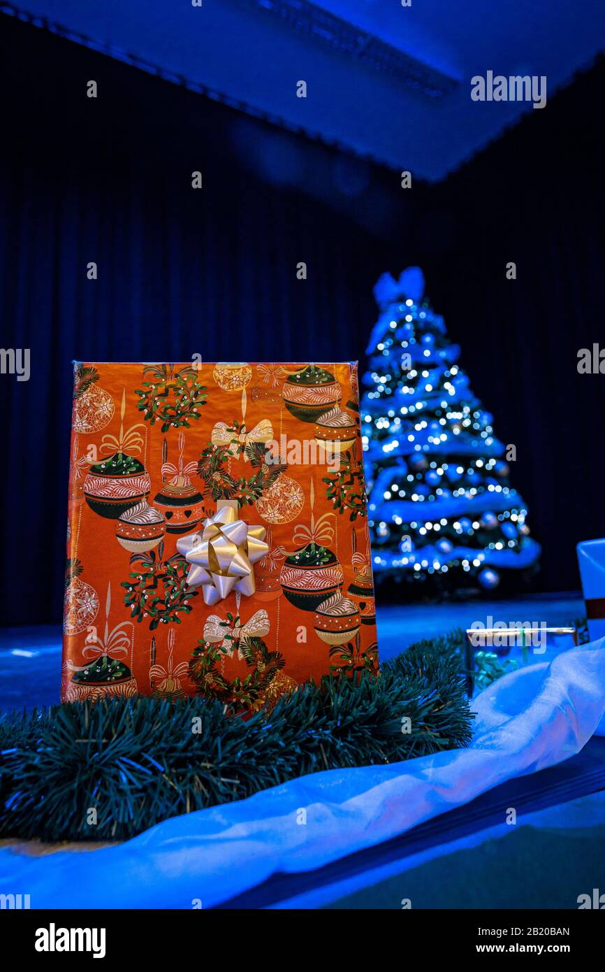 Christmas present and tree as a prop on a stage Stock Photo - Alamy