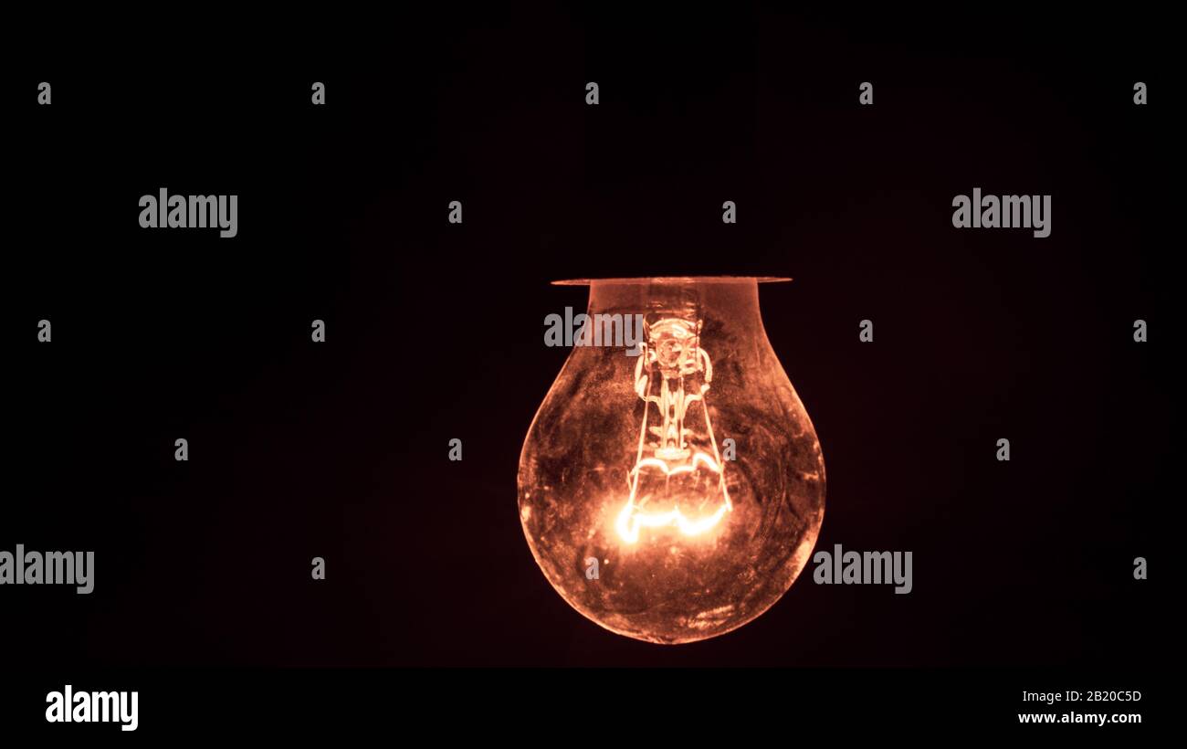 Electric lighting bulb on the dark background Stock Photo - Alamy