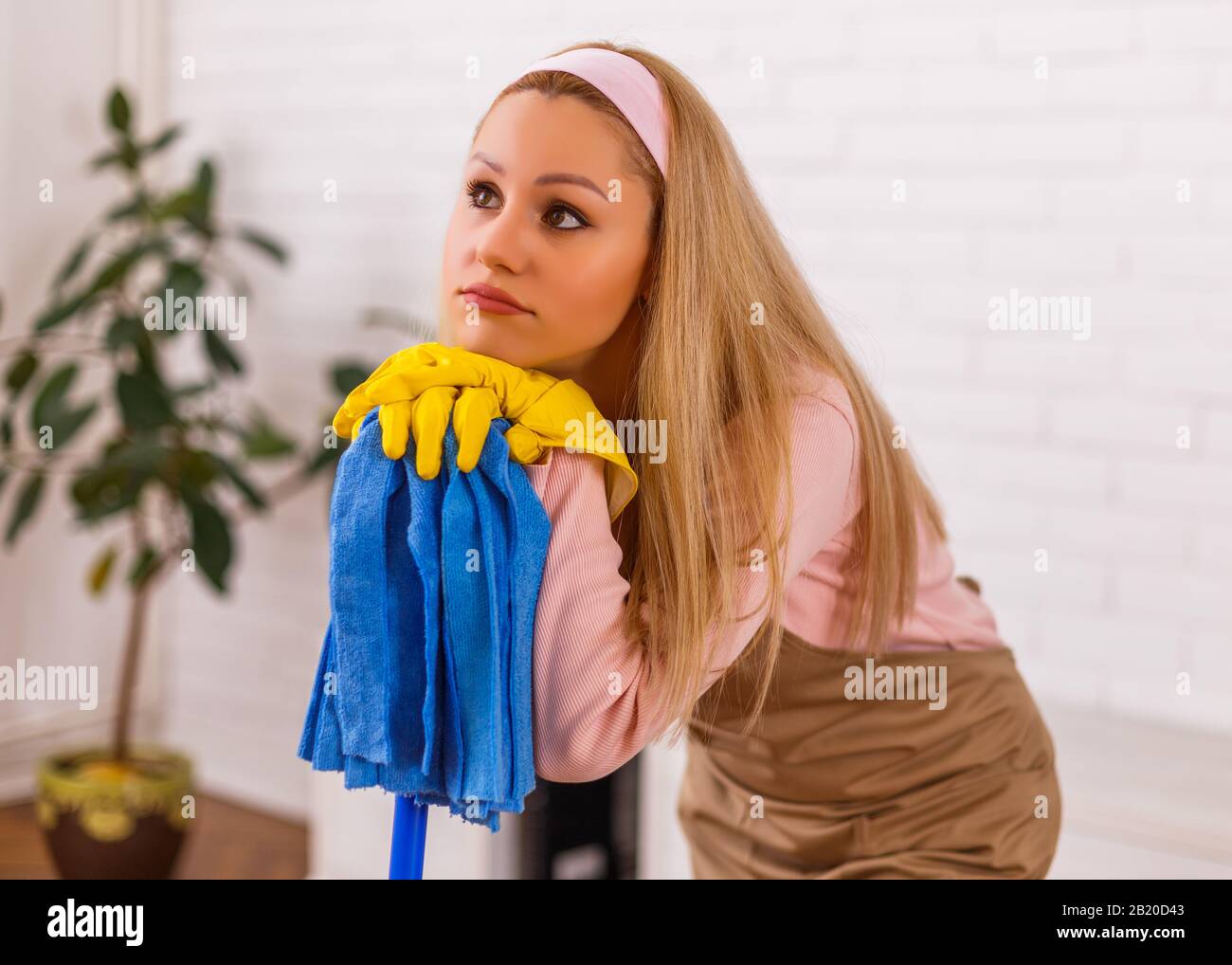 Tired woman cleaning floor hi-res stock photography and images - Alamy