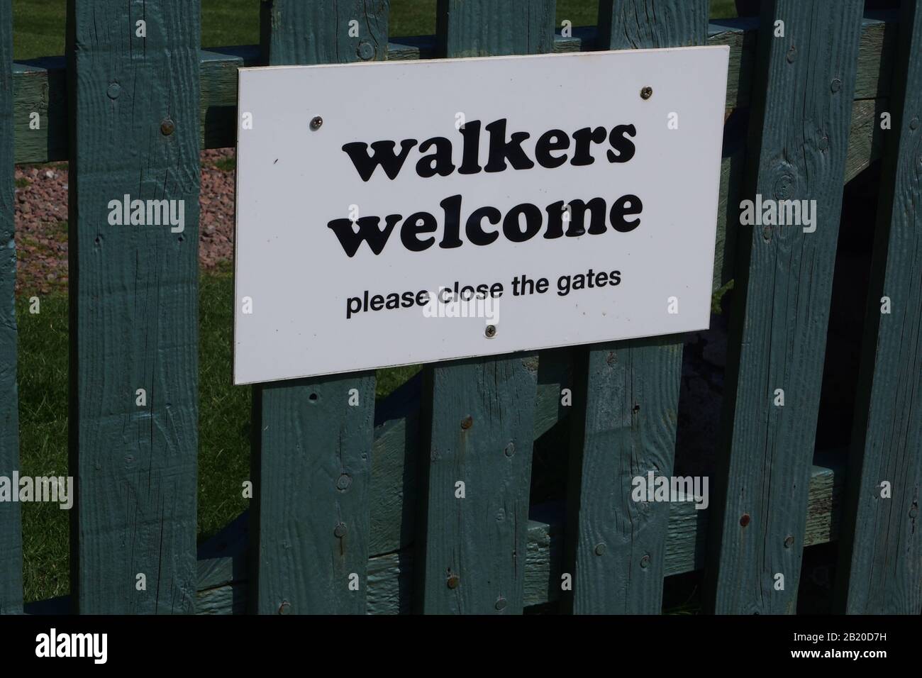 A notice on a gate inviting walkers, ramblers, to enter and continue ...