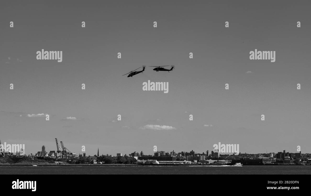 Two helicopters close to each other during flight Stock Photo - Alamy