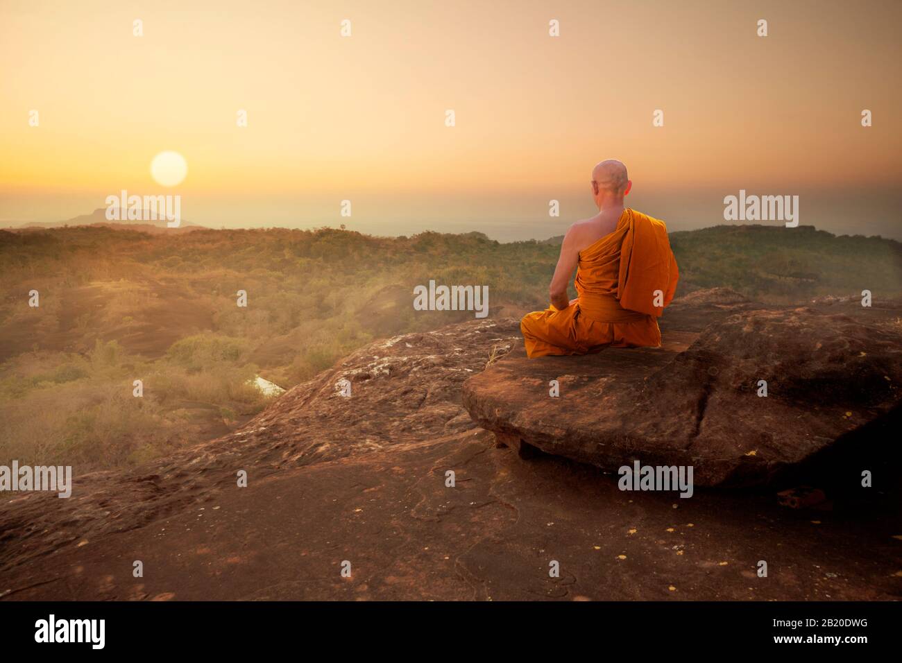 Buddhist monk in meditation at beautiful sunset or sunrise background ...
