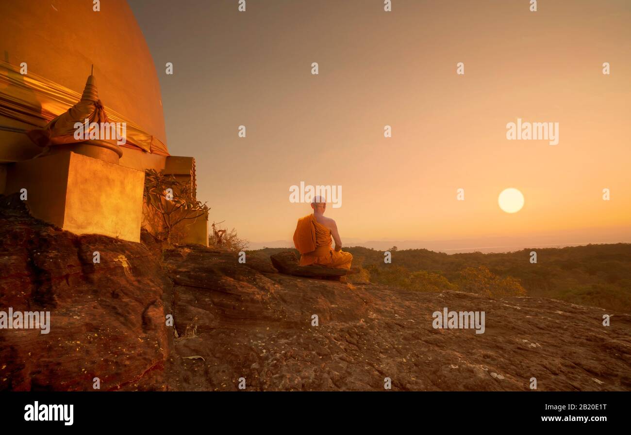 Buddhist monk in meditation at beautiful sunset or sunrise background ...