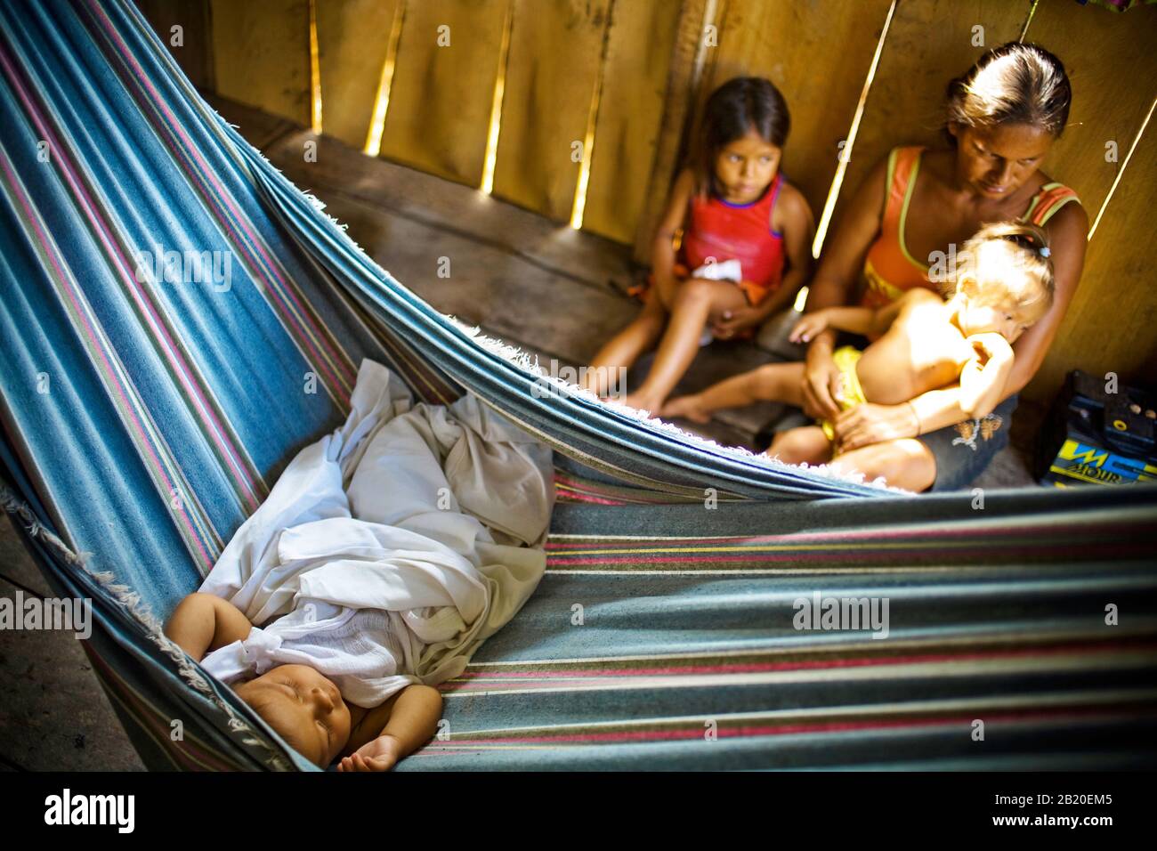 Woman and Seating Children in the Ground, Abacaba Community, Novo Airão ...