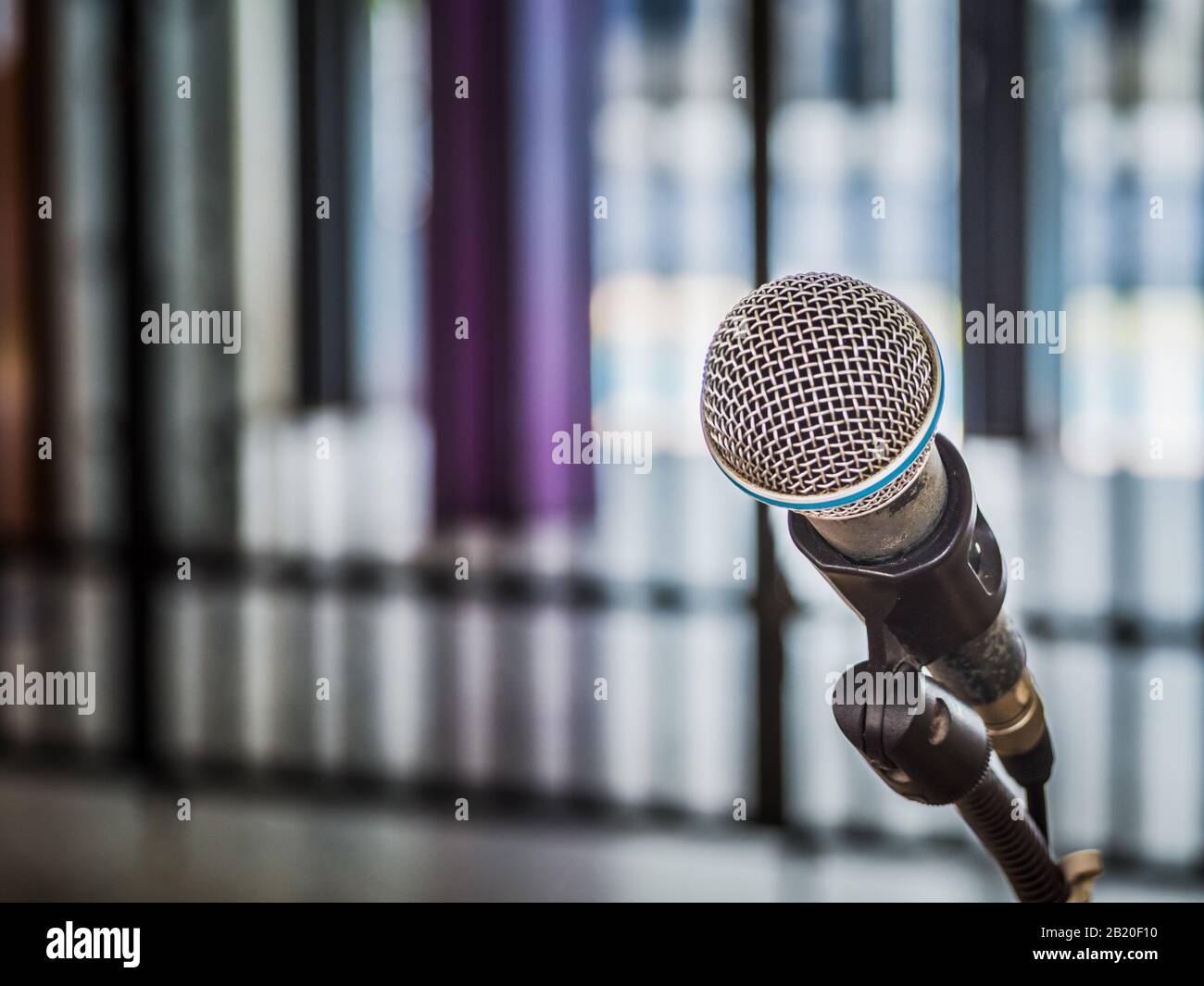 Close up of microphone on abstract blurred background for speech in ...