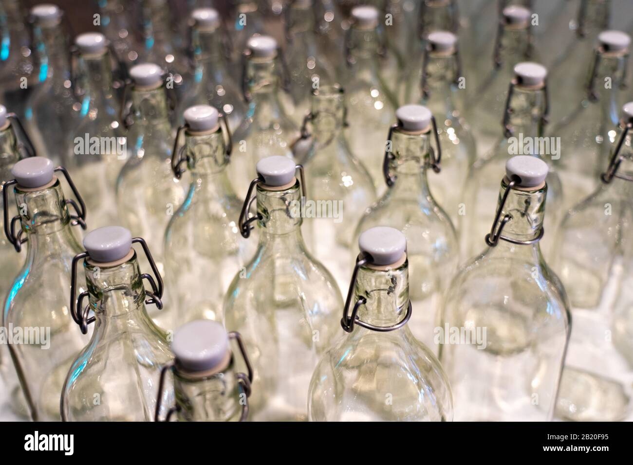 many empty glass bottles with corks, glass empty bottles with white ...