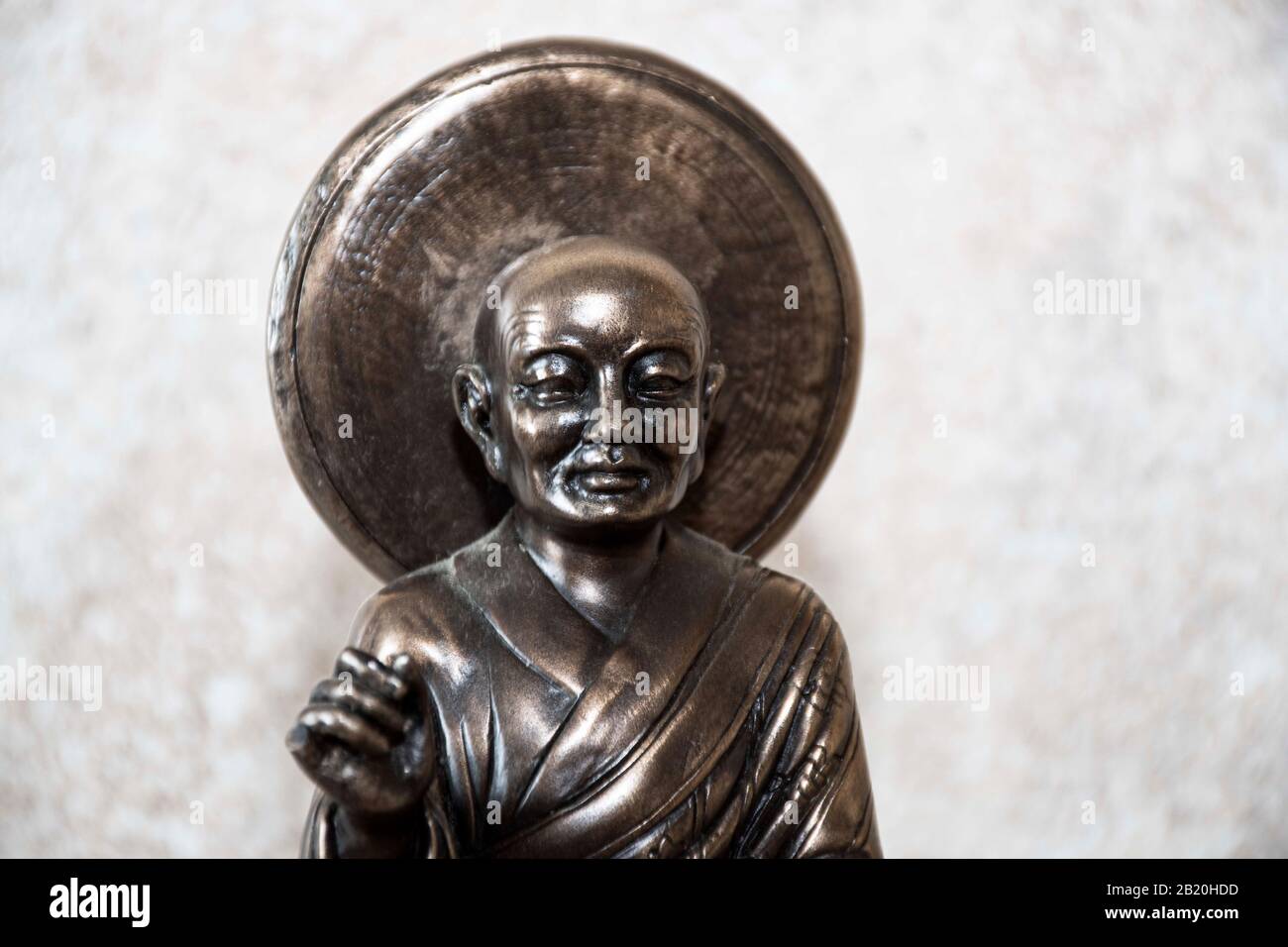Buddhist monk statue bronze resin Stock Photo - Alamy