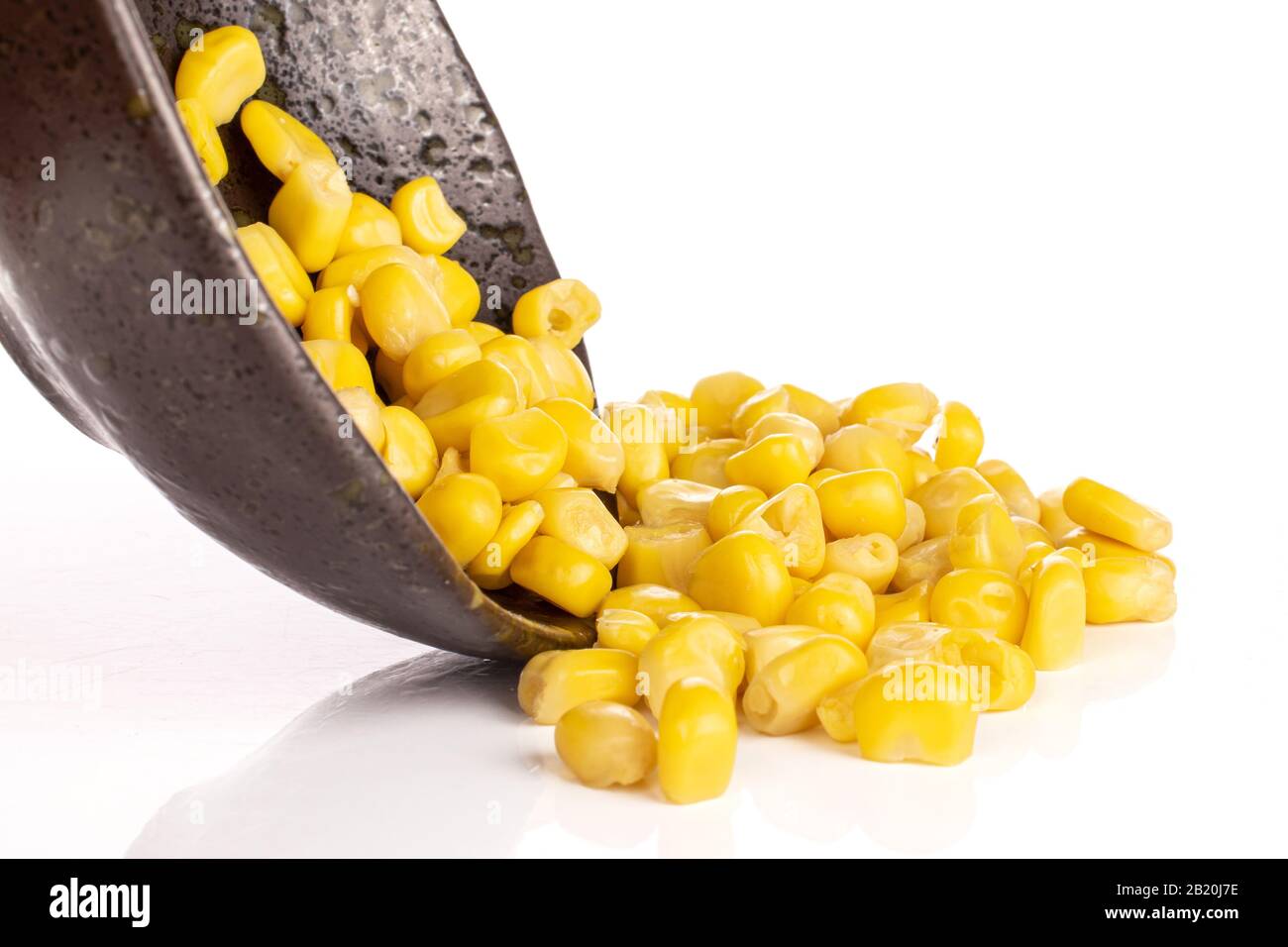 Lot of pieces of canned yellow corn in glazed bowl isolated on white ...