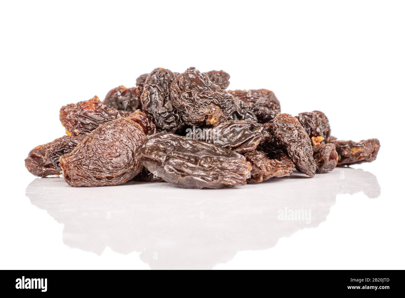 Lot of whole dried dark raisin stack isolated on white background Stock ...