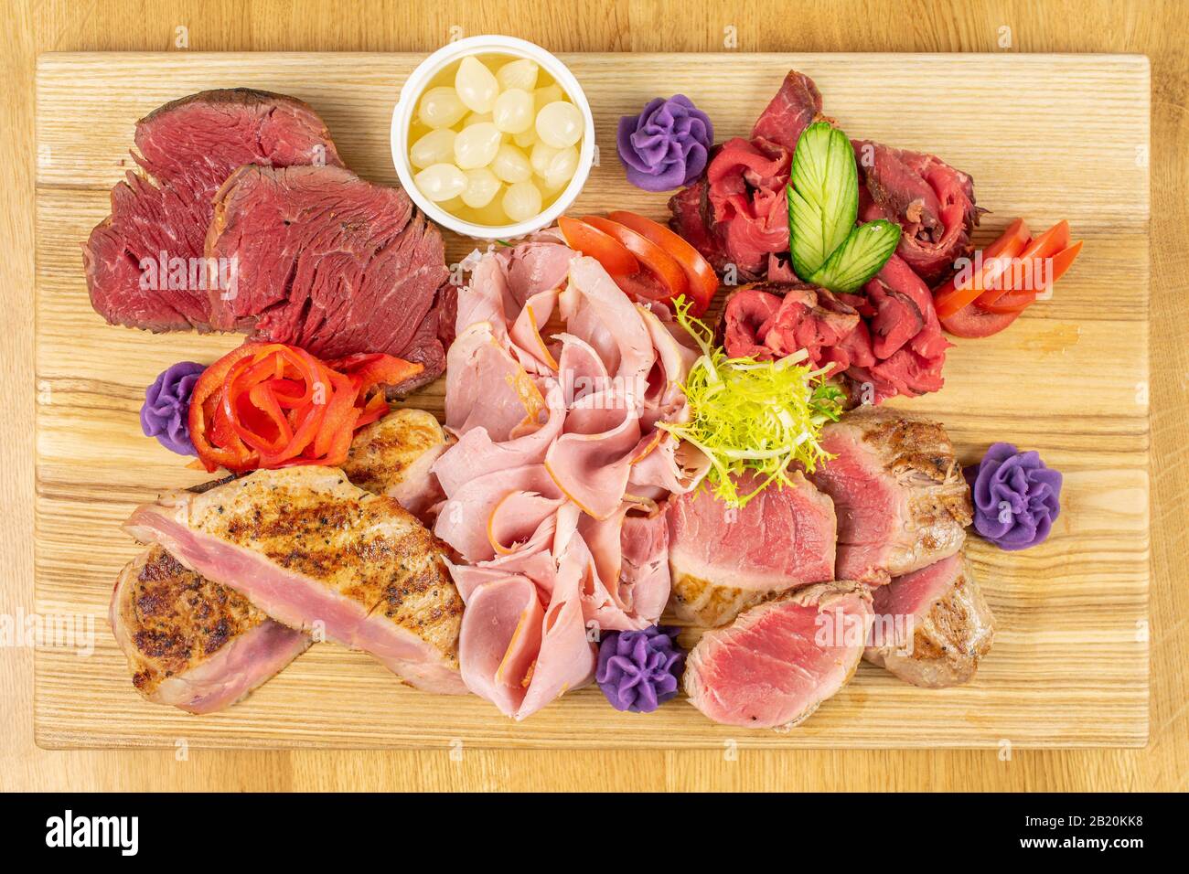 Beautiful meat board flatlay on lacquered wood Stock Photo - Alamy