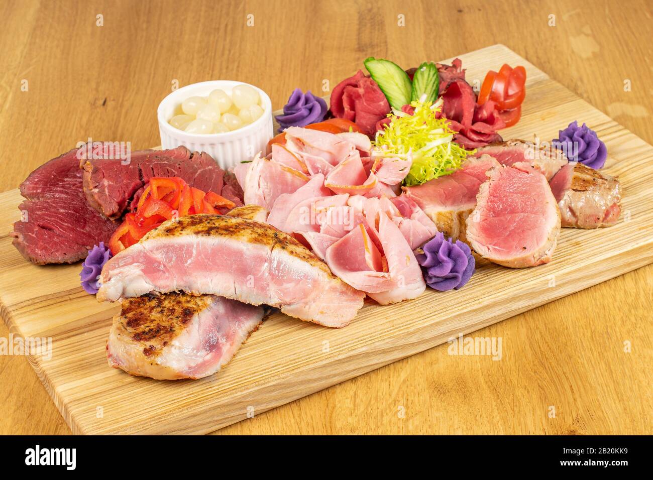 Beautiful meat board on lacquered wood Stock Photo - Alamy
