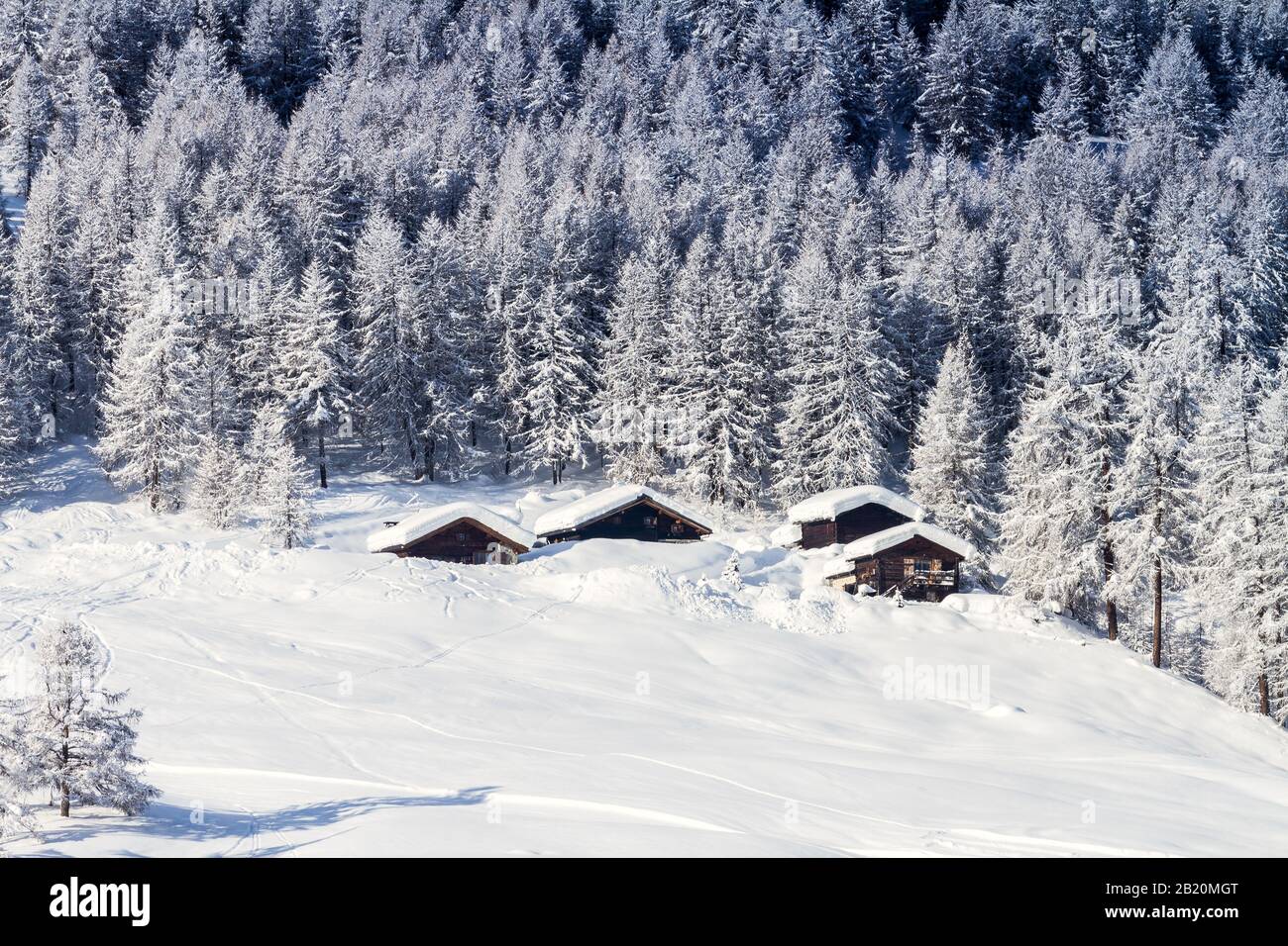 huts in snowy alpine landscape Stock Photo - Alamy