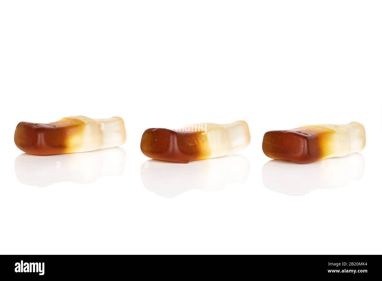 Group of three whole sweet jelly cola isolated on white background ...