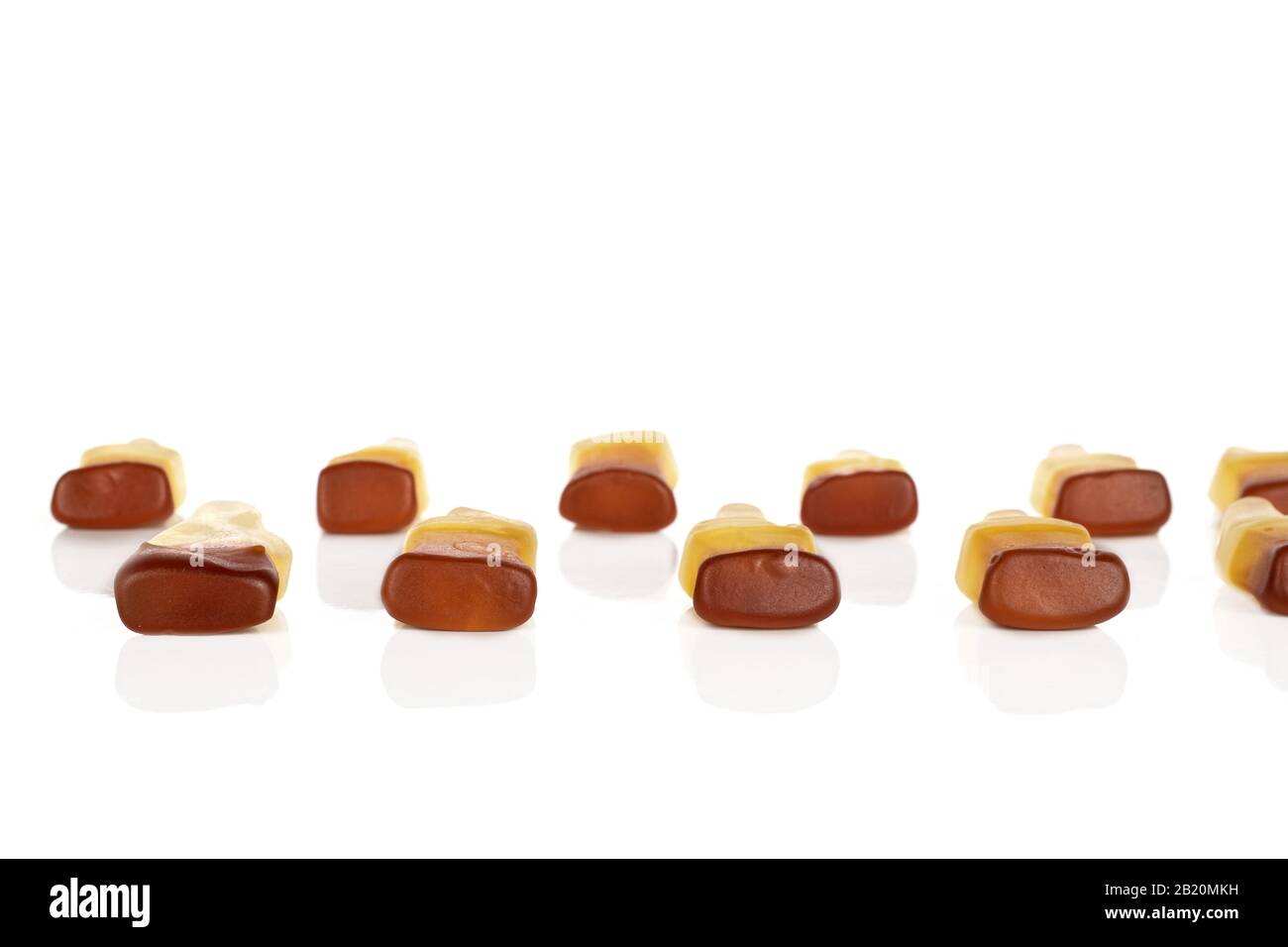 Lot of whole arranged sweet jelly cola isolated on white background ...