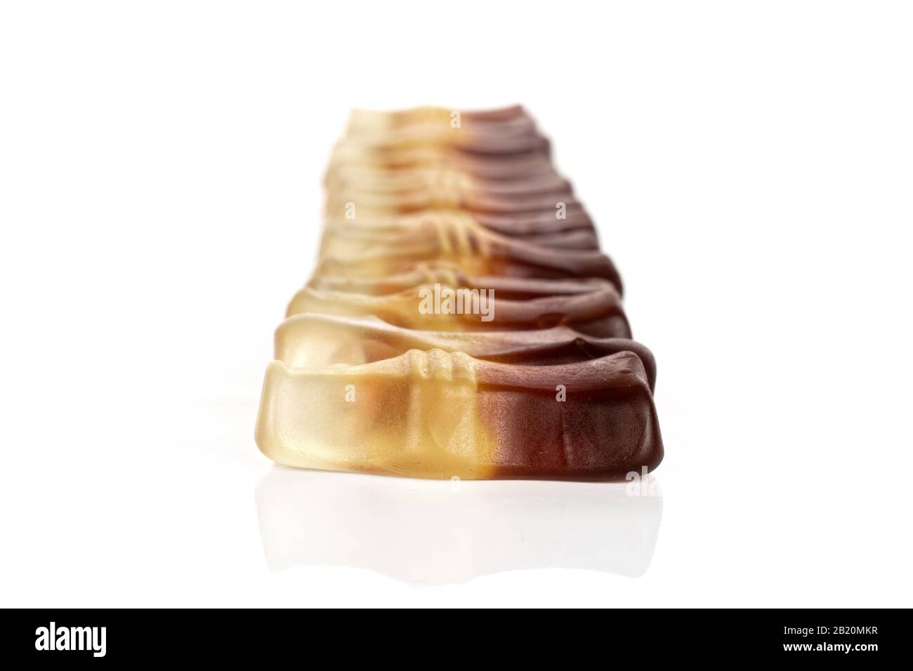 Lot of whole sweet jelly cola in row isolated on white background Stock ...