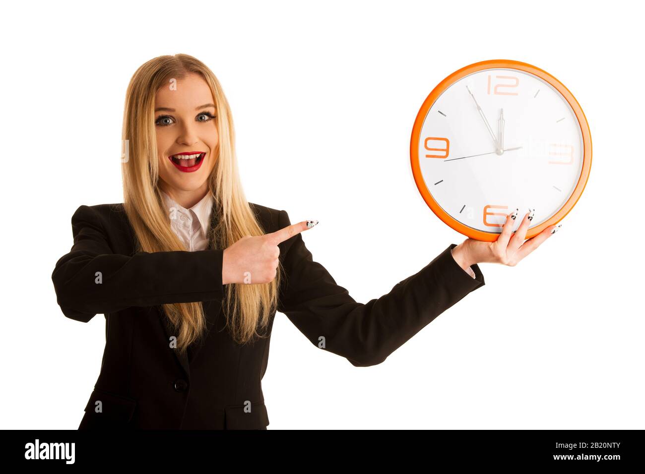 Beautiful business woman holds a clock as a sign for time management ...
