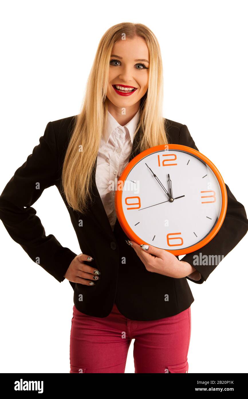 Beautiful business woman holds a clock as a sign for time management ...