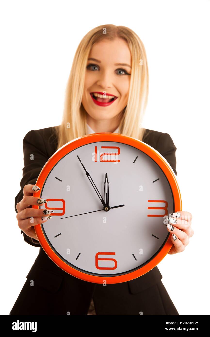 Beautiful business woman holds a clock as a sign for time management ...