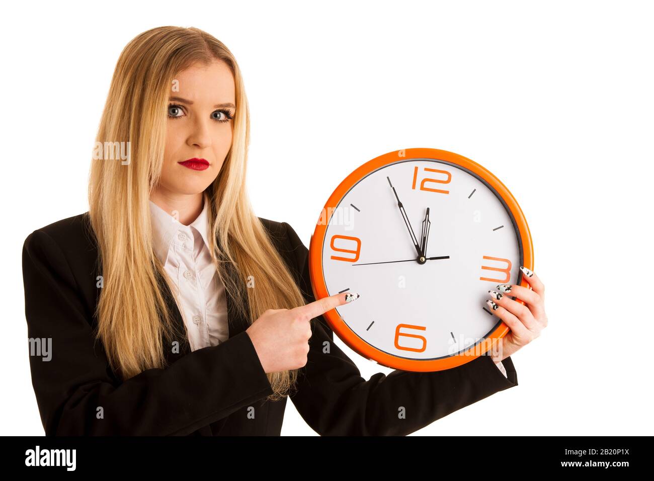 Beautiful business woman holds a clock as a sign for time management ...