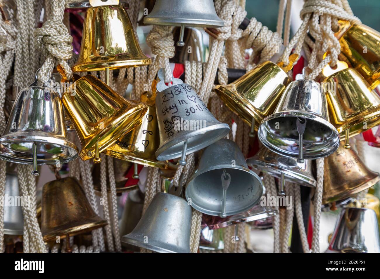 Small love bells, a token of affection, attached to the railings and ...