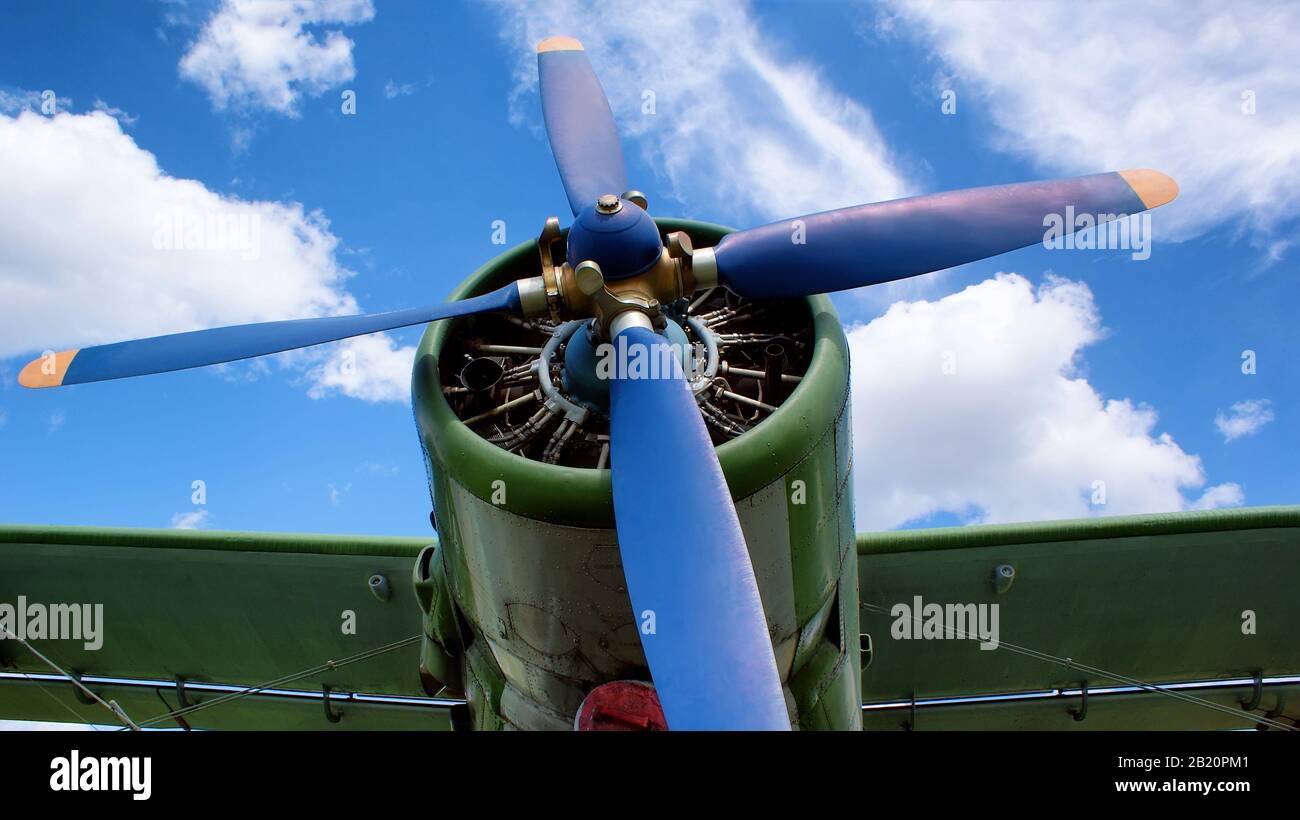 The engine of the screw plane of an old aircraft. Blades of blue retro ...