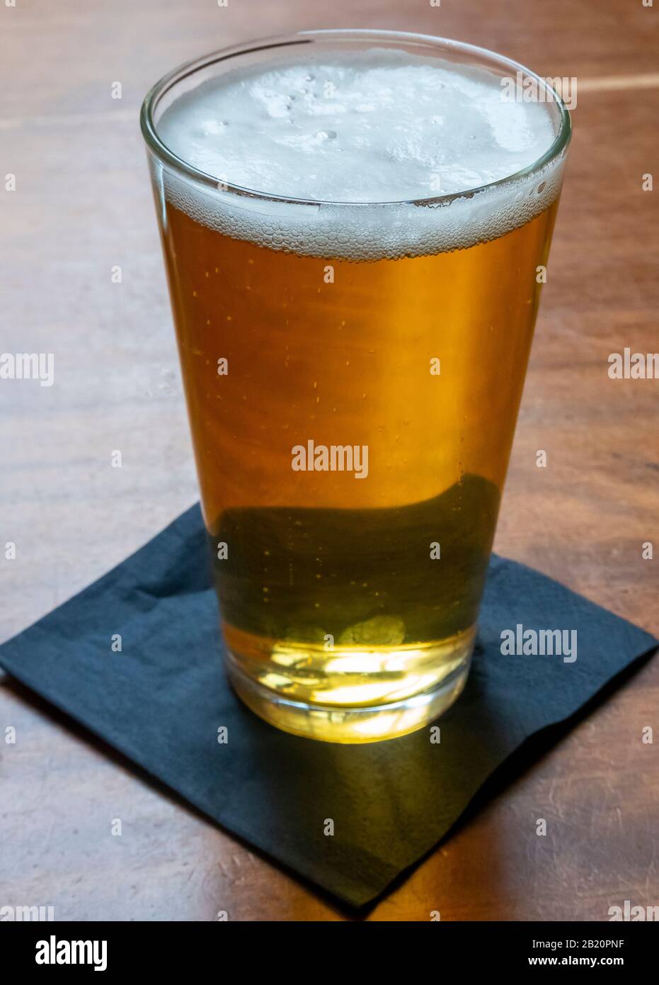 A tall glass of draught lager beer in a plain tall glass Stock Photo ...