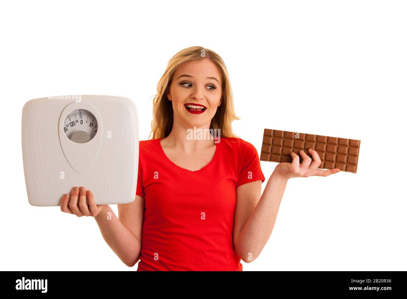 Undecided woman holding scale and chocolate uncertain wether to loose ...