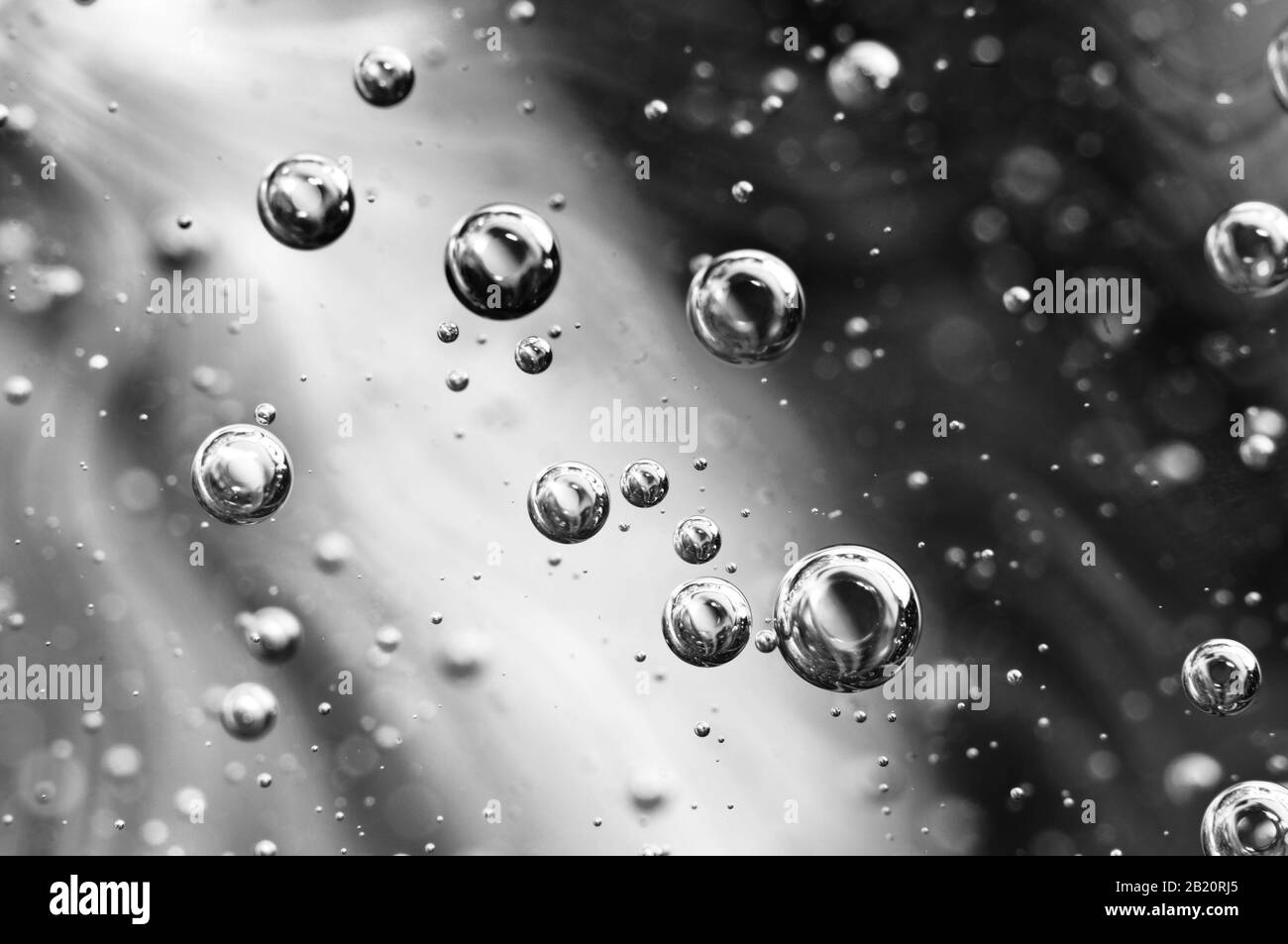 Black and white photography. Oxygen bubbles in water on black white ...