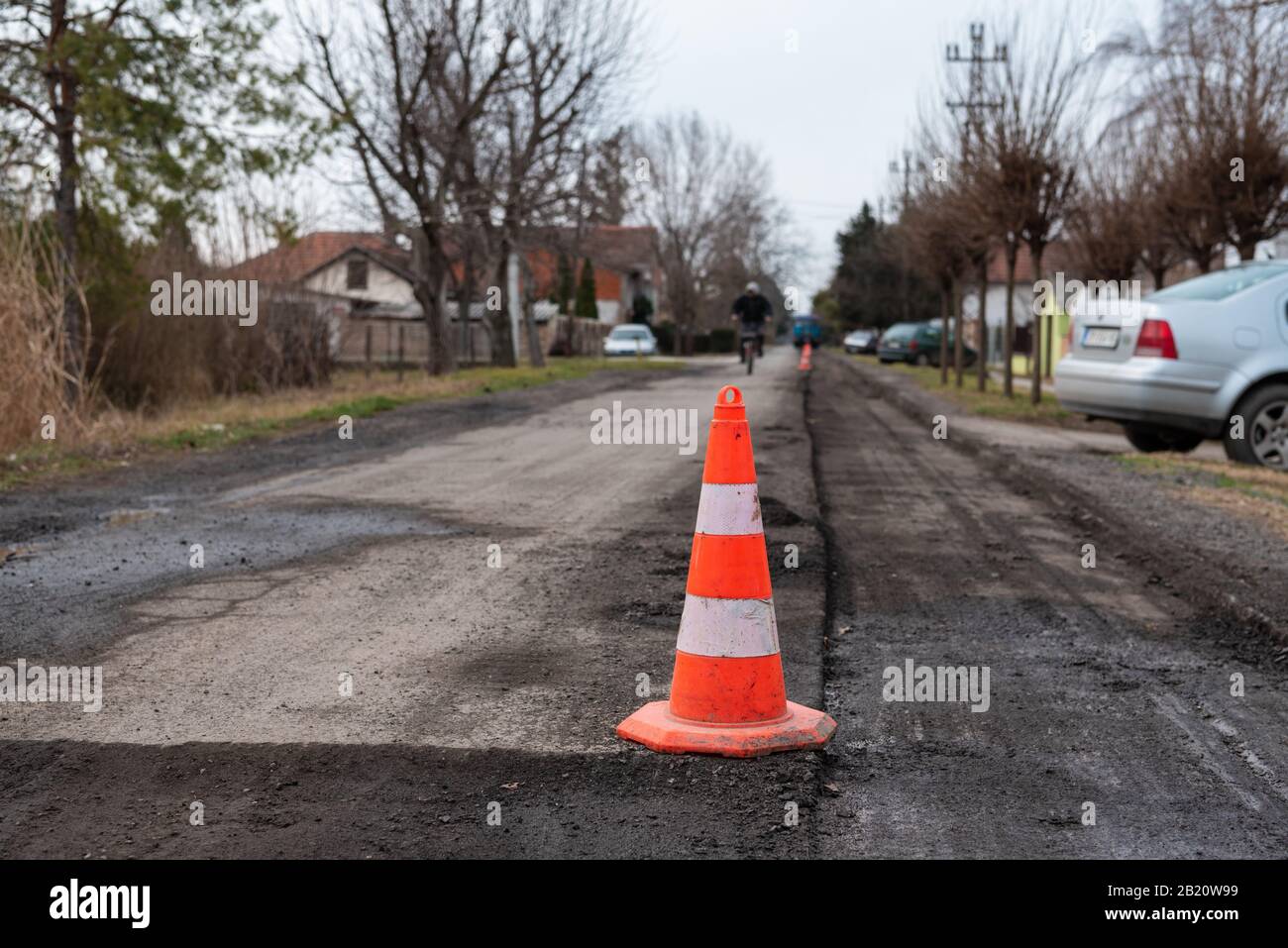 Workers with machinery preparing the road for new asphalt Stock Photo ...