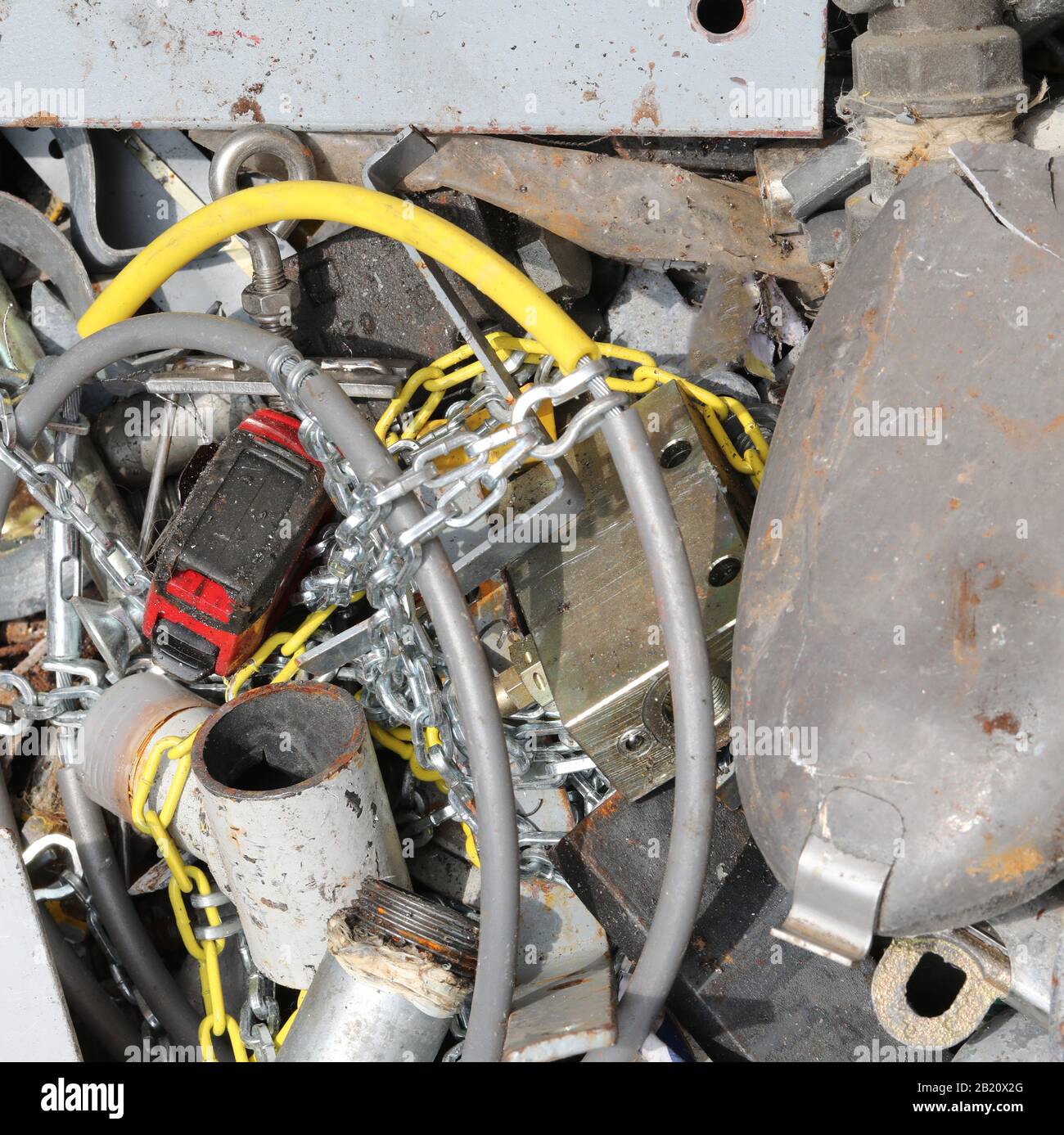 background of old rusty pieces of iron of a landfill to recycle unused ...