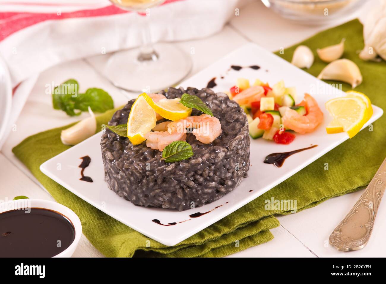 Squid ink risotto Stock Photo - Alamy