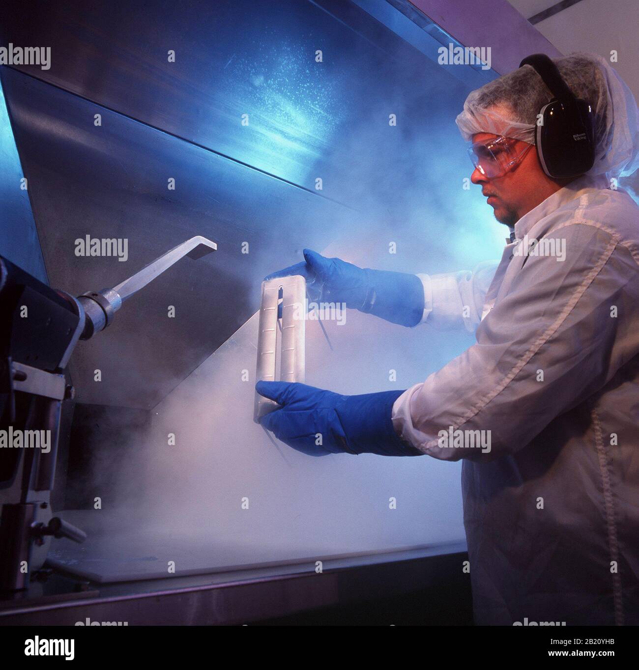 Austin Texas USA, 1994: High tech clean room: Employee in "bunny suit ...