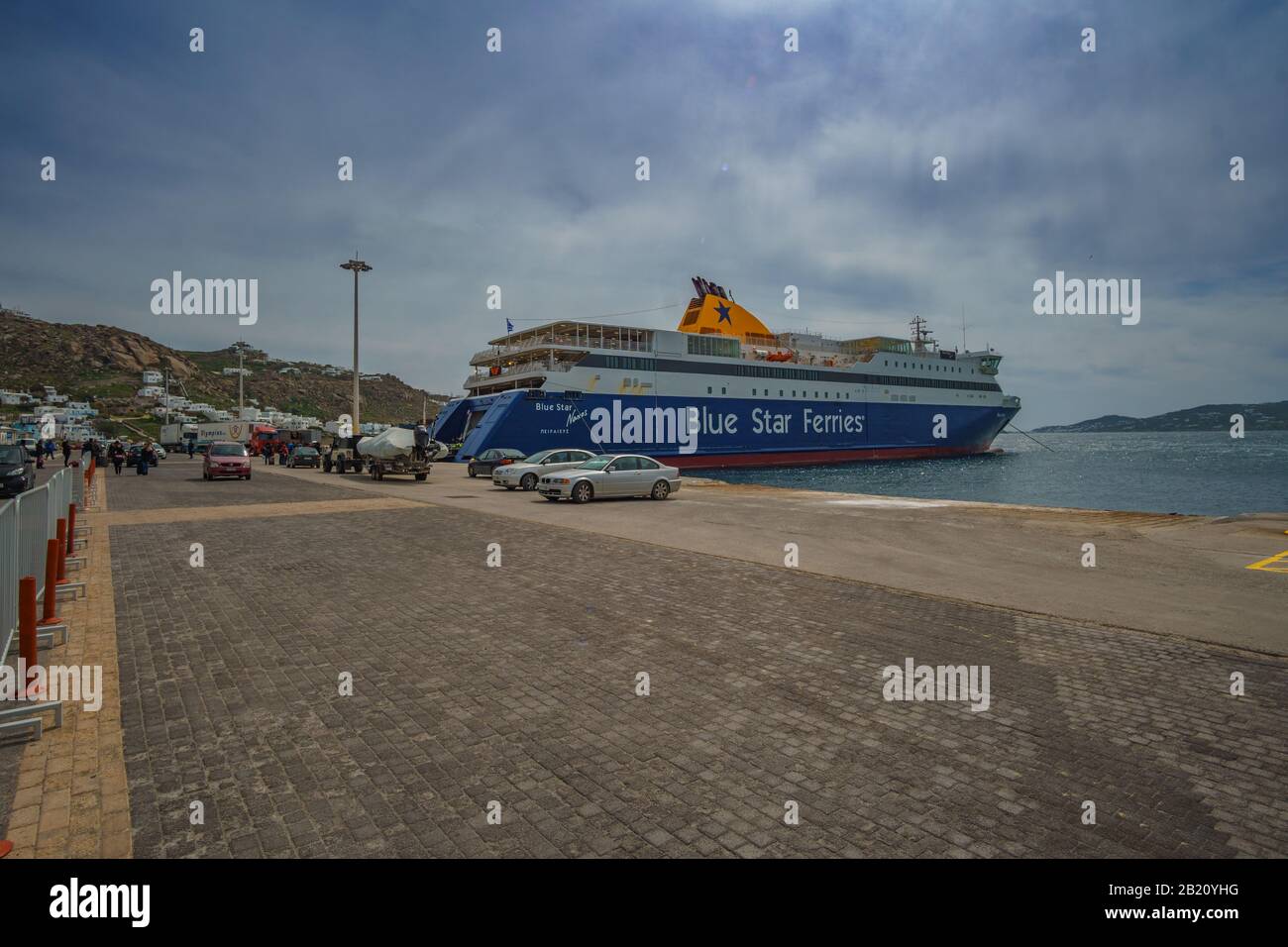 Blue Star Naxos Ferry boat leaving the port of Mykonos island. Blue Star Ferries is one of the ...