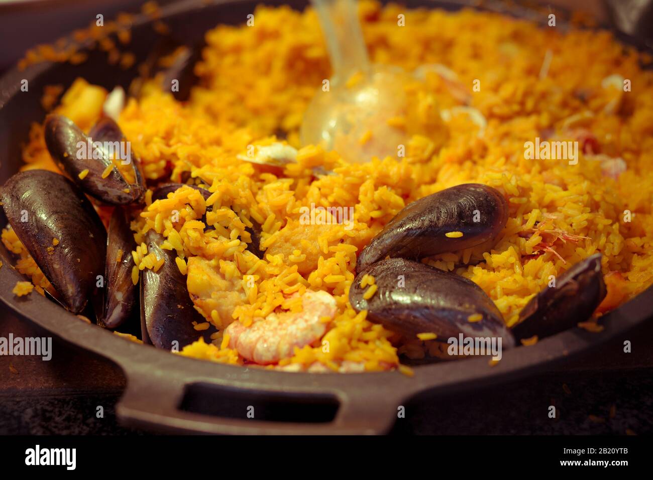 typical spanish paella with yellow rice and seafood Stock Photo - Alamy