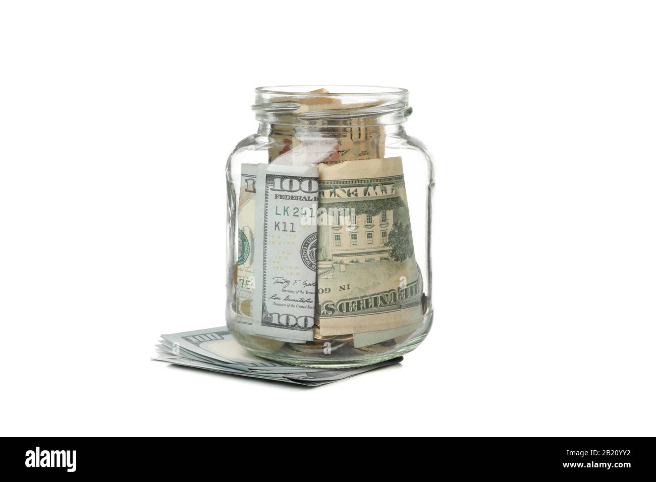 Glass jar with money isolated on white background Stock Photo - Alamy