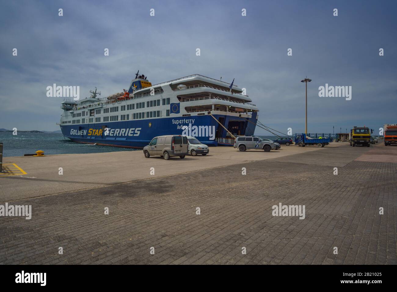 Blue Star Naxos Ferry boat leaving the port of Mykonos island. Blue Star Ferries is one of the ...