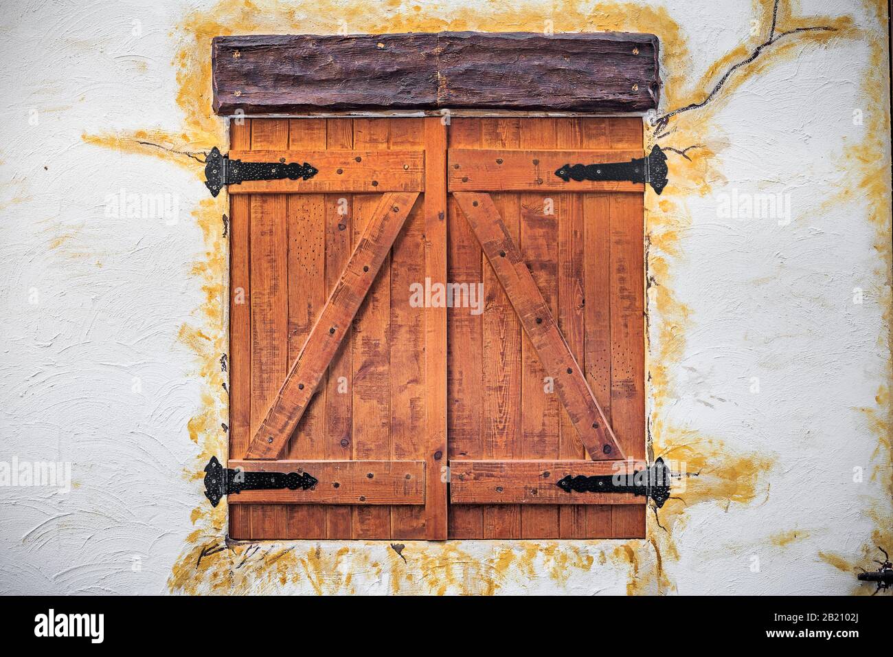 old fashioned wooden window closed on white rustic facade Stock Photo ...