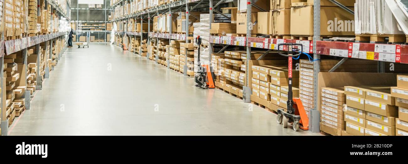 Rows of shelves with boxes in a modern warehouse Stock Photo - Alamy