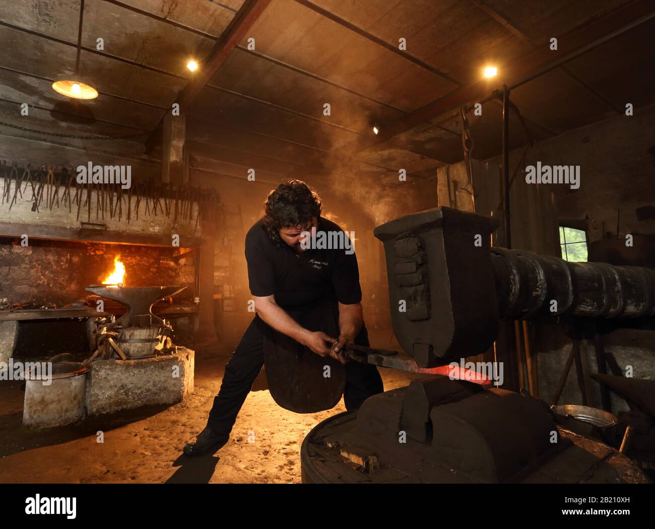 Blacksmith at the forge hammer, hammer mill Burghausen, Upper Bavaria ...