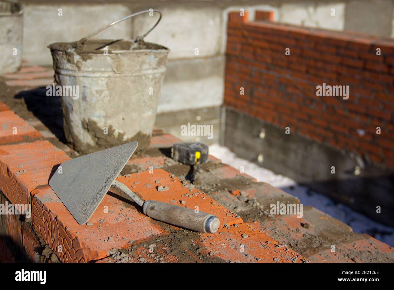 Workplace of the master in masonry. Mason trowel close-up. Industrial ...