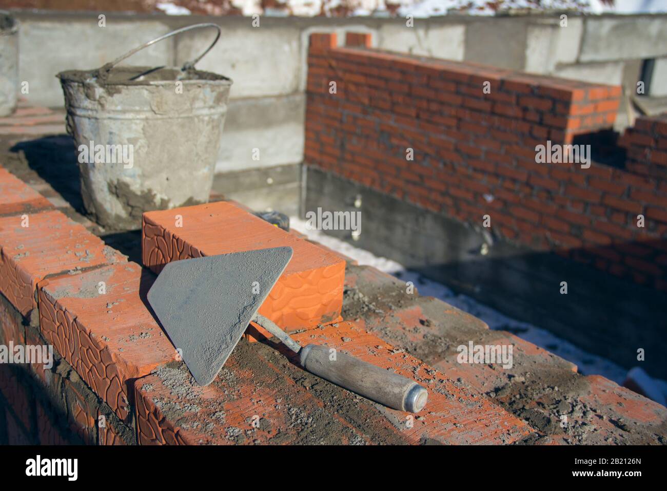 Workplace of the master in masonry. Mason trowel close-up. Industrial ...