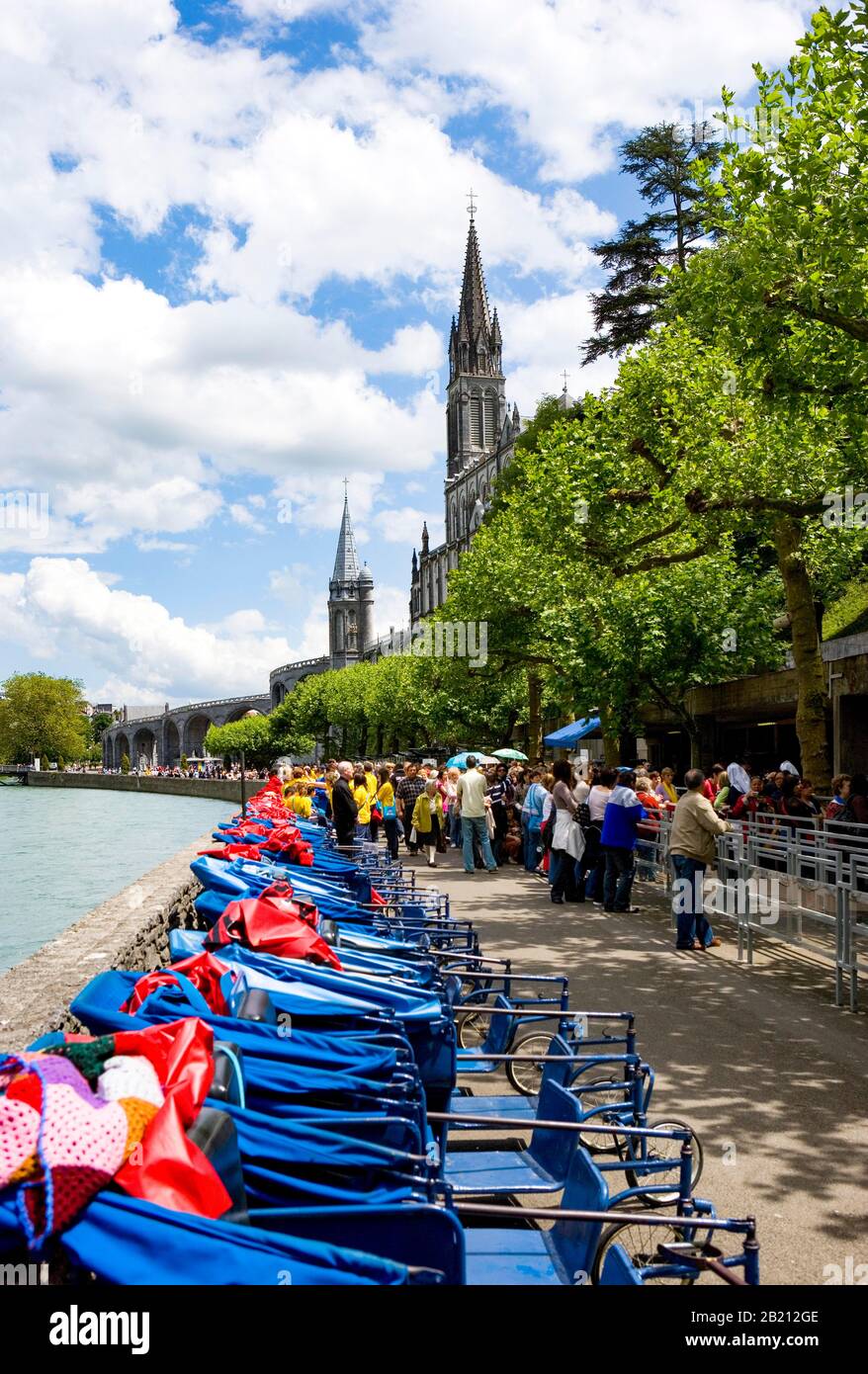 Pilgrims and wheelchairs in front of the baths, Basilica of the Rosary ...