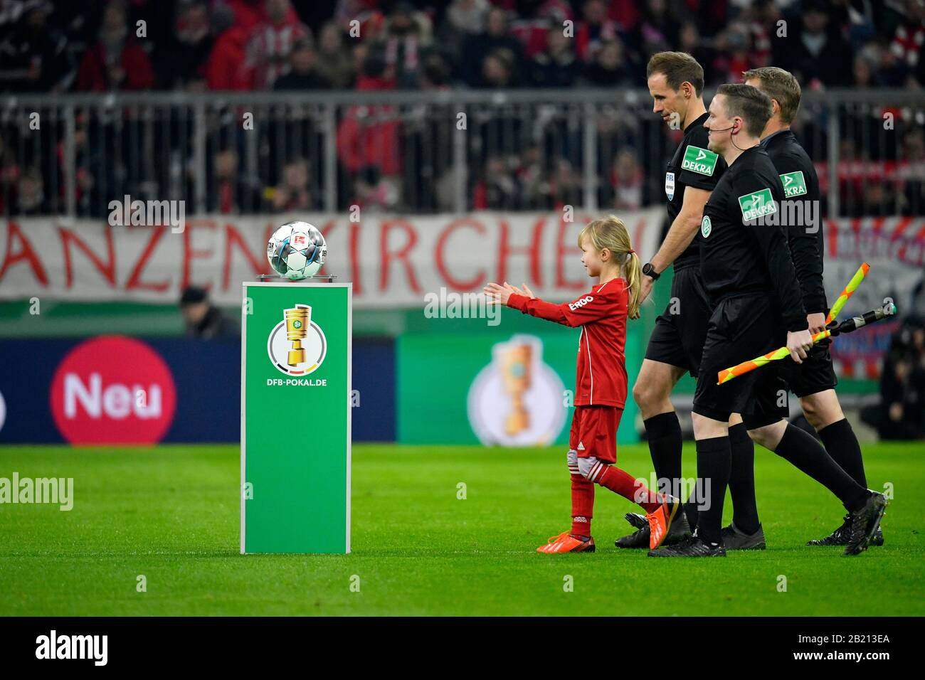 Ball child ball girl runs with outstretched arms towards the ball, with ...