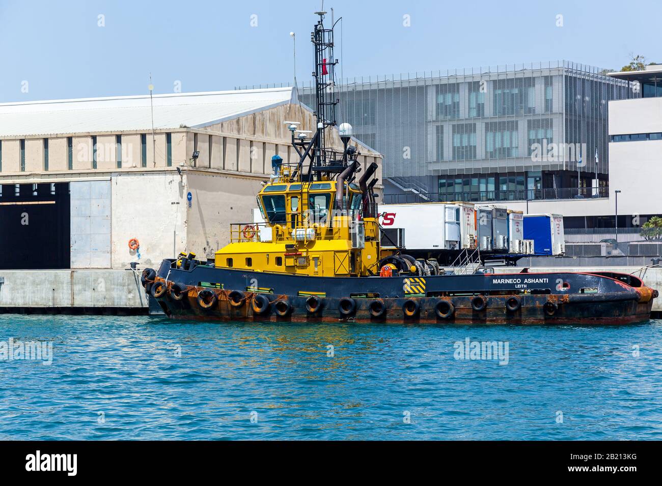 Malta Valletta June 16, 2019: A big yellow tugboat is anchored near a ...