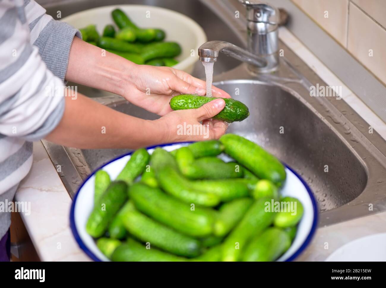 Close up person washing cucumber hi-res stock photography and images ...