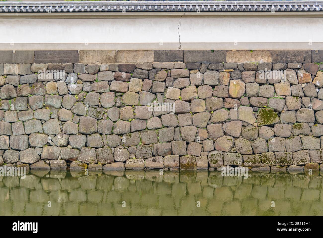 Ancient stone patterned wall of imperial palace gardens, tokyo, japan ...